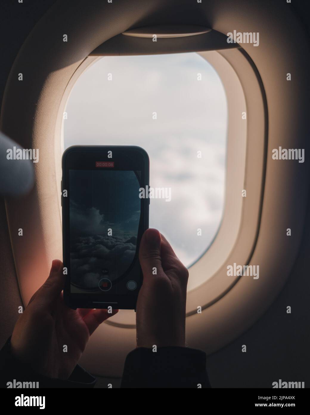 Flying Ireland over the clouds. taking a photo from the airplane window ...