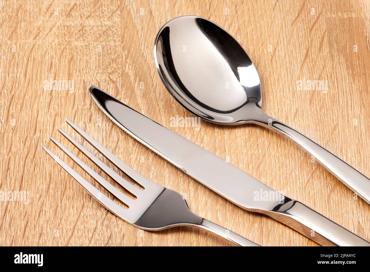 Fork, knife, spoon on wooden table. Cutlery set Stock Photo - Alamy