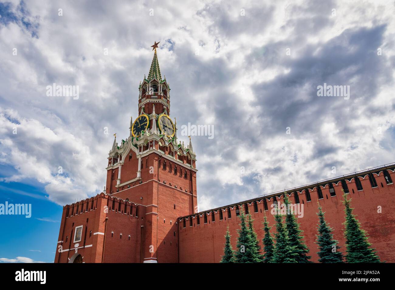 Red Square. Spasskaya tower with a clock on a background of cloudy sky ...