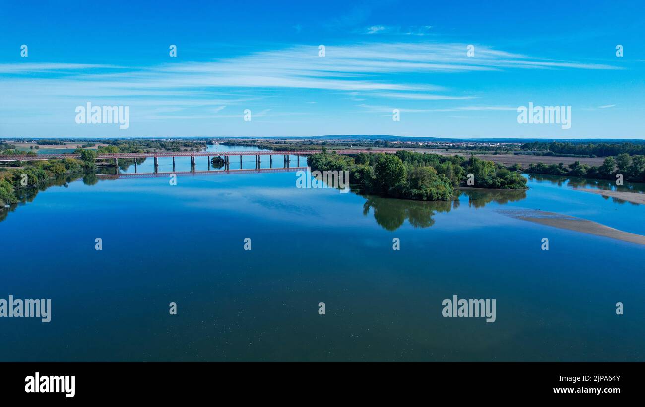Aerial view over Tejo river towards the Queen Maria Amelia Bridge, in ...