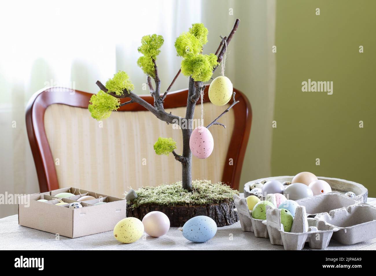 Florist At Work Woman Shows How To Make Easter Decoration In Tree Shape With Hanging Eggs Step