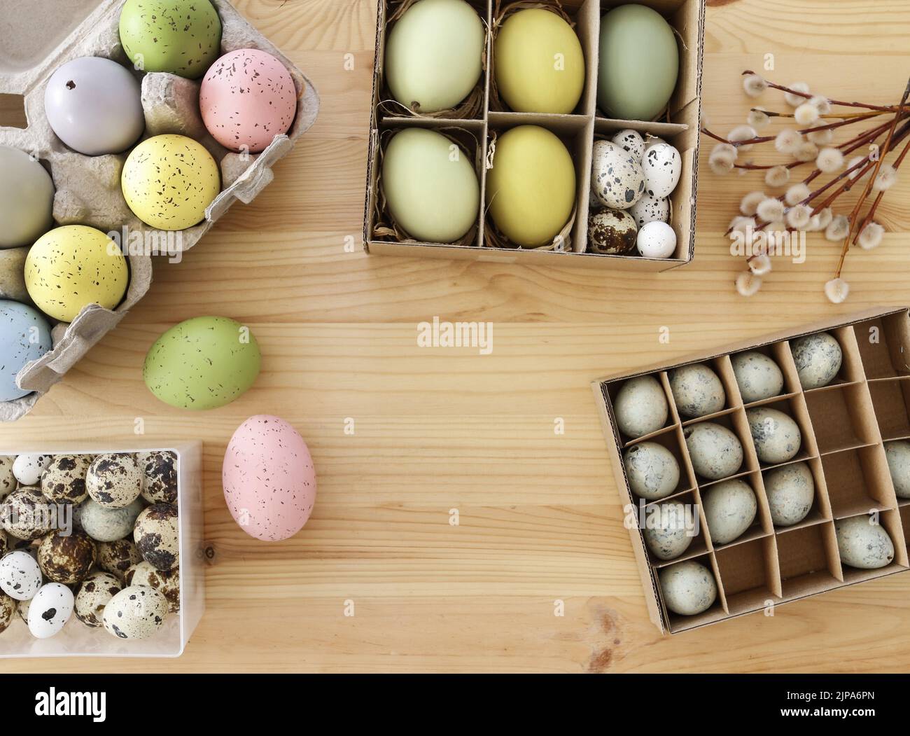 Easter eggs on wooden table. Festive time Stock Photo - Alamy
