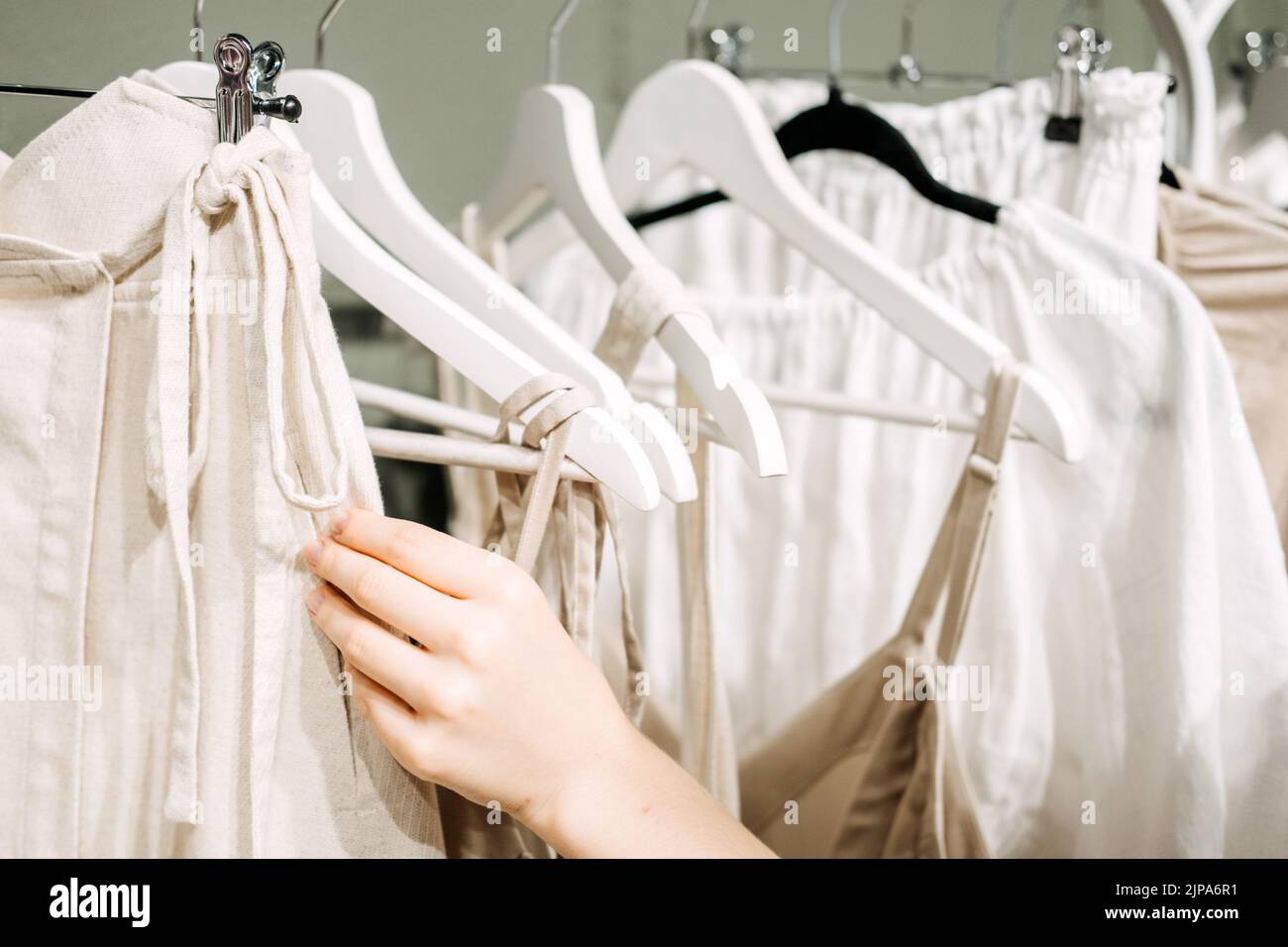 Sustainable fashion, slow fashion. Close Up Shot of female hand taking ...