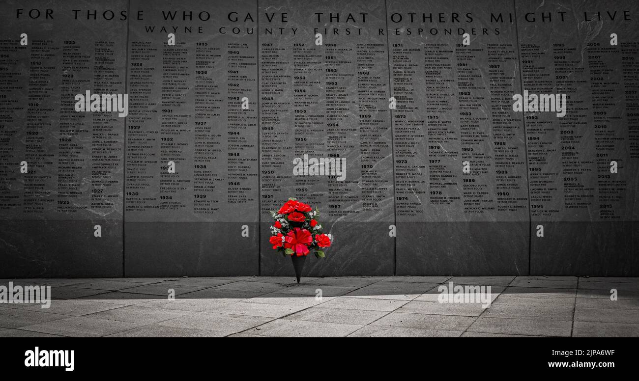 A closeup of red flowers placed in front of Wayne County first ...