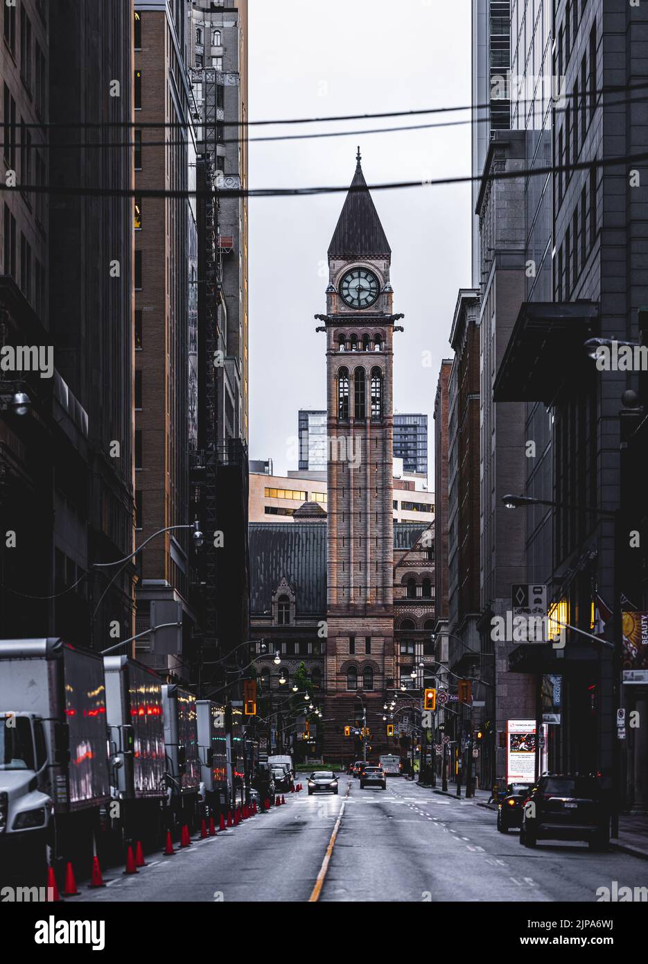 A vertical shot of Toronto Old City Hall from Bay street with cars ...