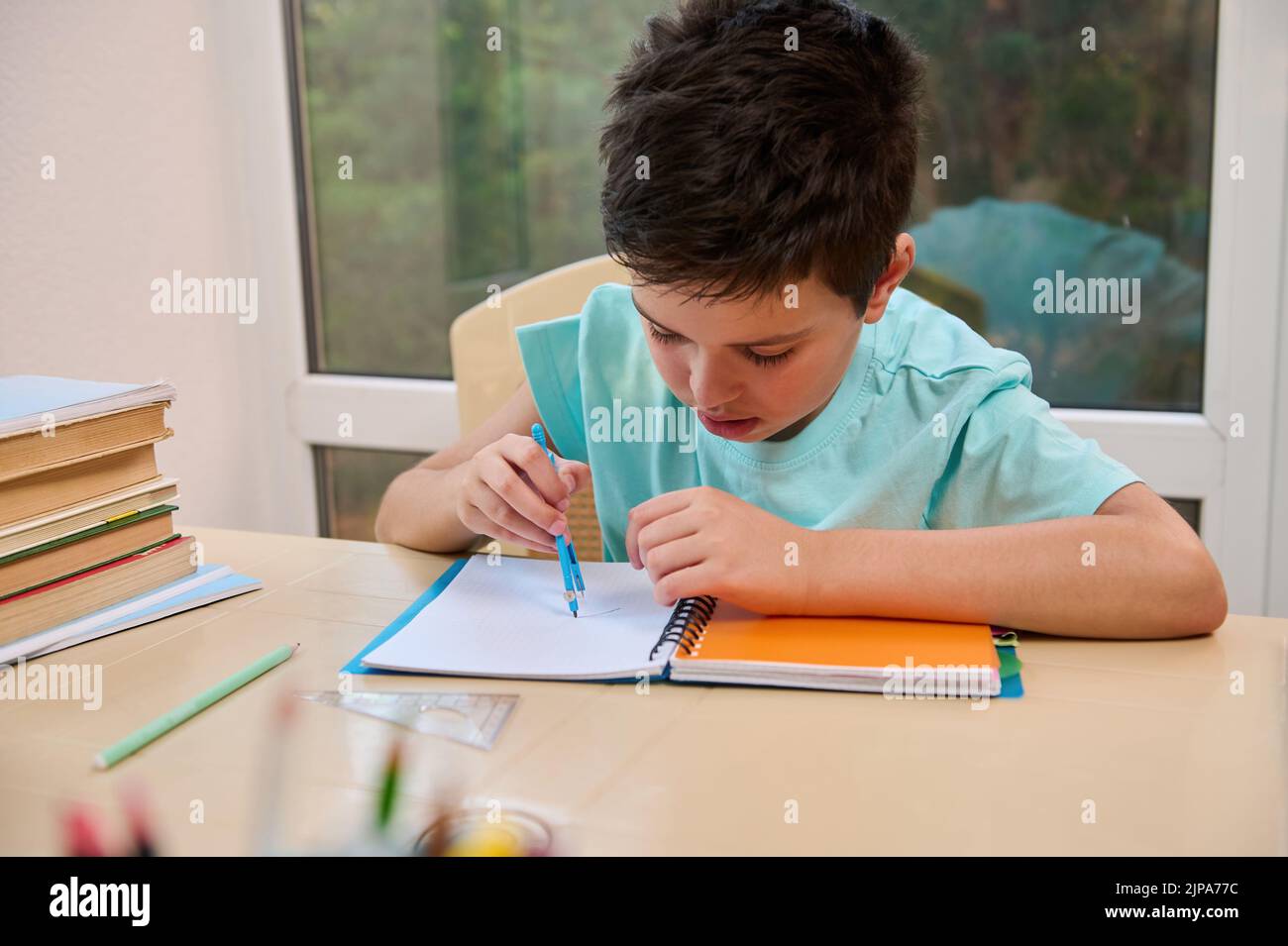 Smart schoolboy using drawing hi-res stock photography and images - Alamy