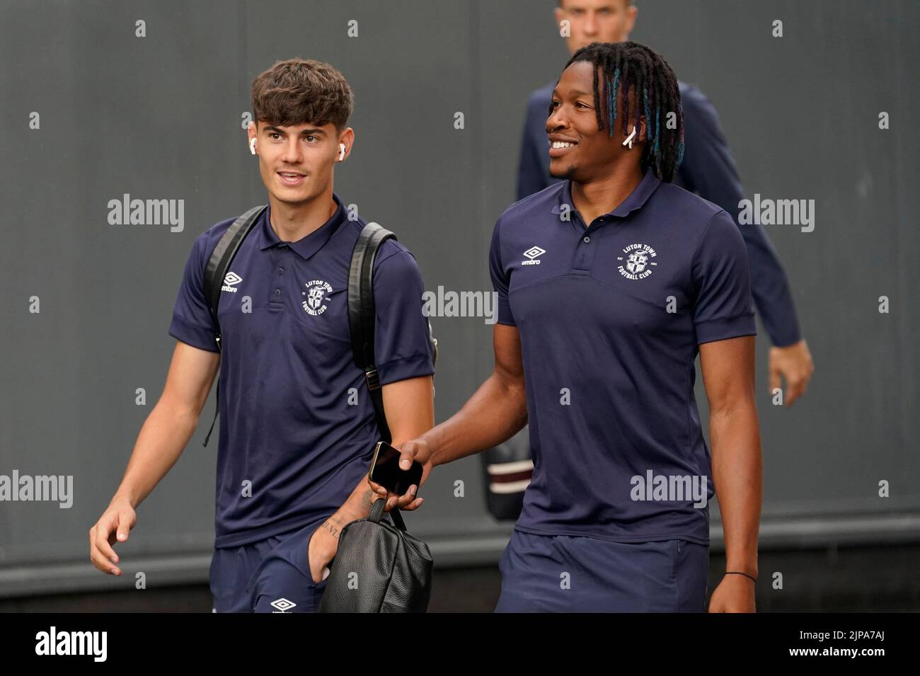 Luton Town's Gabriel Osho (right) and Elliot Thorpe arrive before the ...