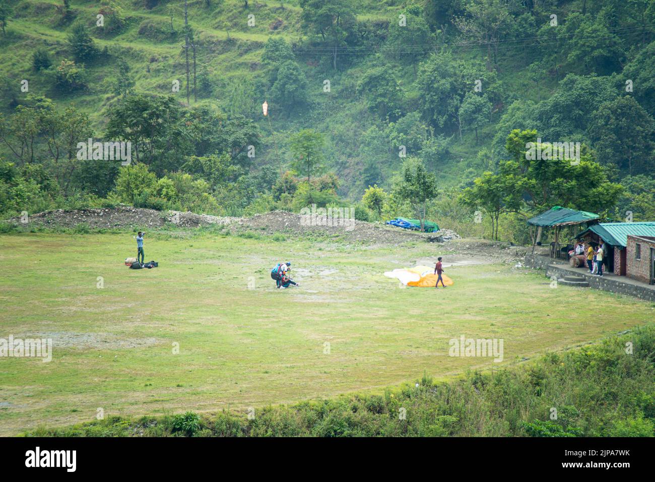 landing site for para gliding people with folded parachute ground ...