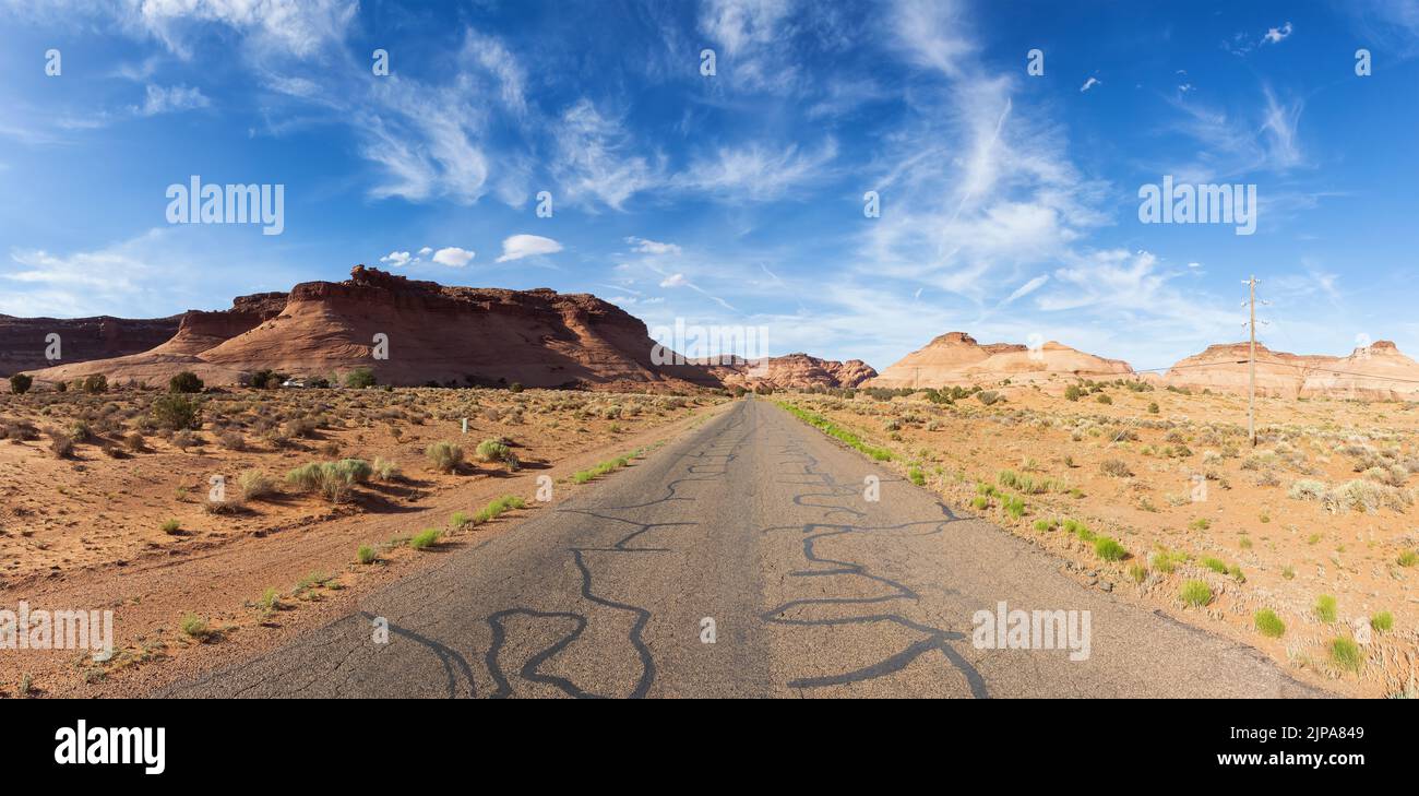 Scenic Road in the Dry Desert with Red Rocky Mountains in Background ...