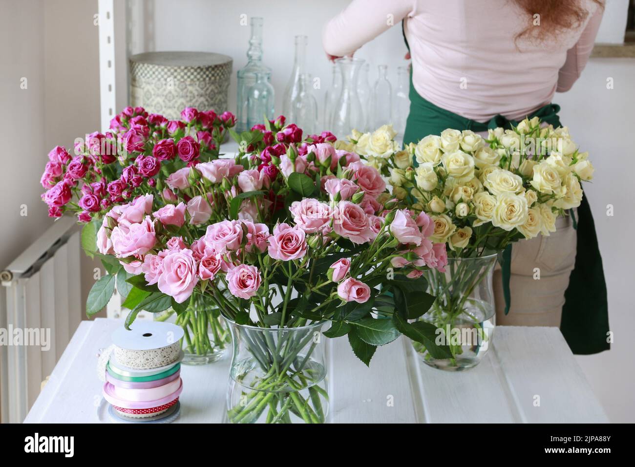 Fresh roses for sale at the florist shop. Garden hobby Stock Photo - Alamy
