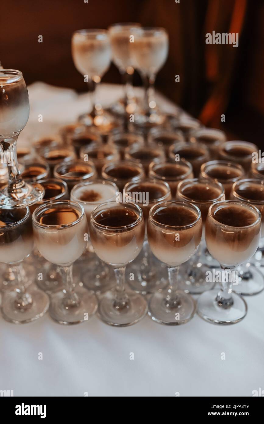 Catering. Drinks on wedding party. Cocktail glasses full of red alcohol ...