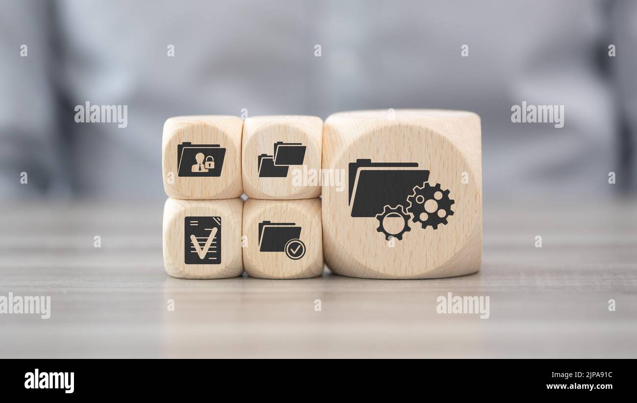 Wooden blocks with symbol of document management concept Stock Photo ...