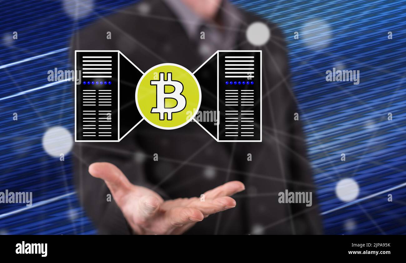 Bitcoin mining concept above the hand of a man in background Stock ...