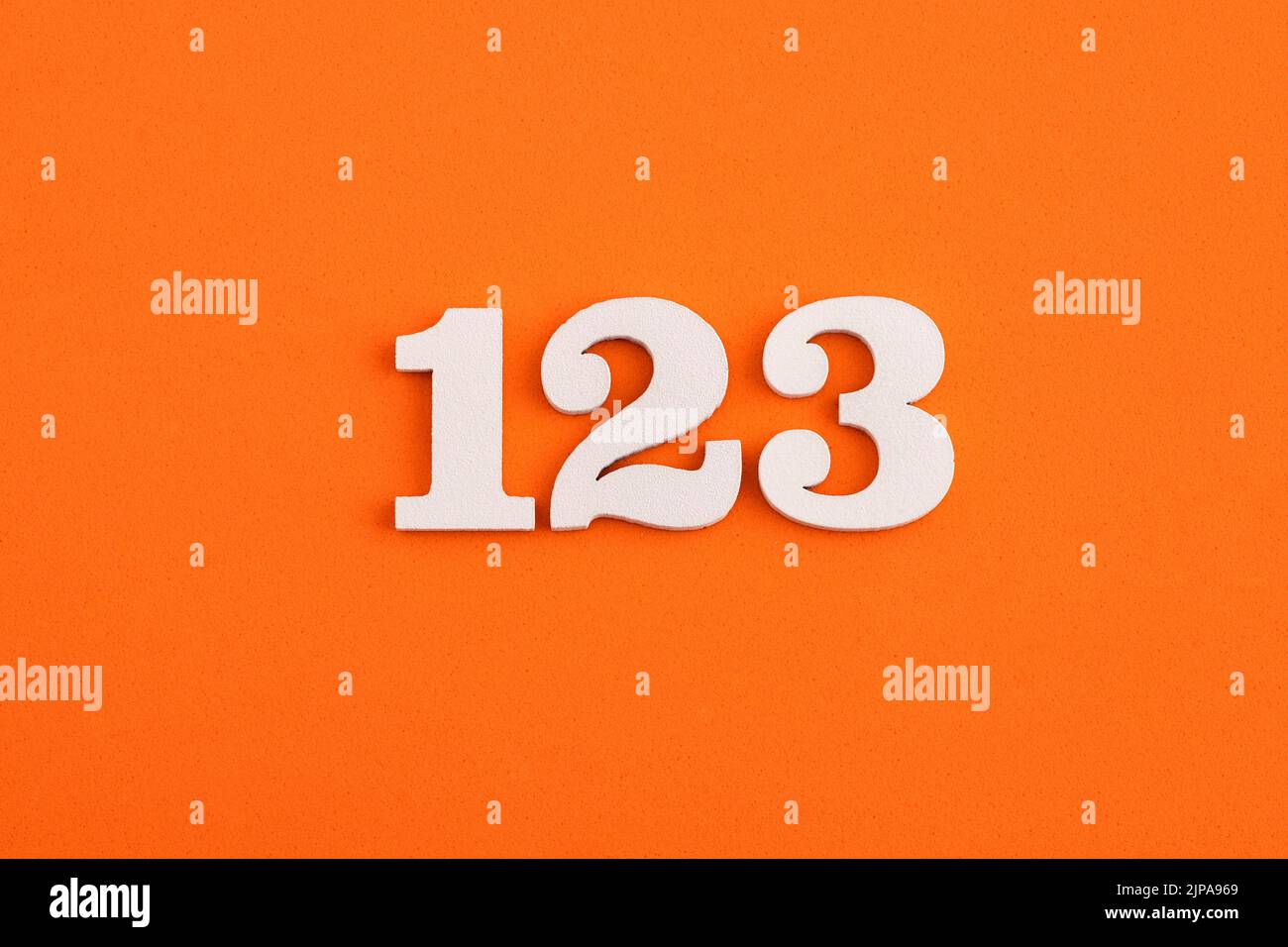 Number 123 - On orange foam rubber background Stock Photo - Alamy