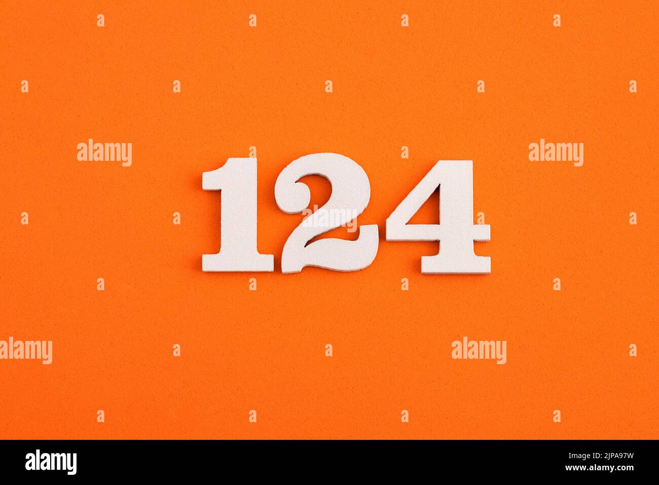 White wooden number 124 on eva rubber orange background Stock Photo - Alamy