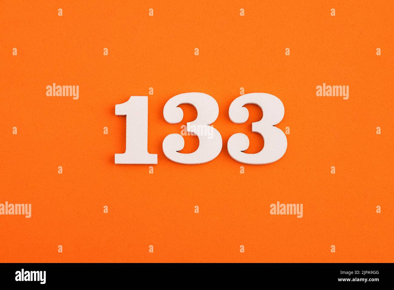 Number 133 - On orange foam rubber background Stock Photo - Alamy