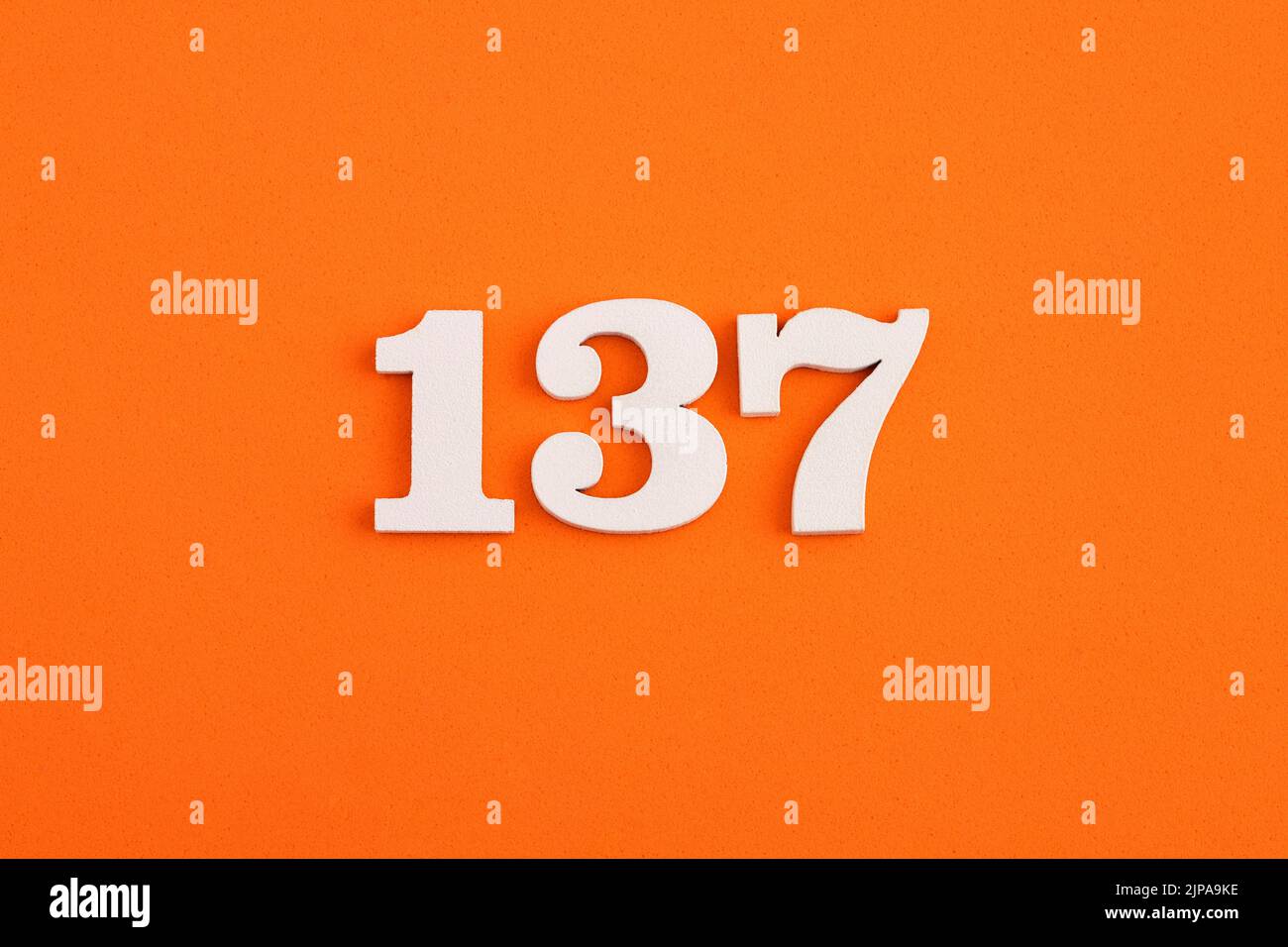 Number 137 - On orange foam rubber background Stock Photo - Alamy