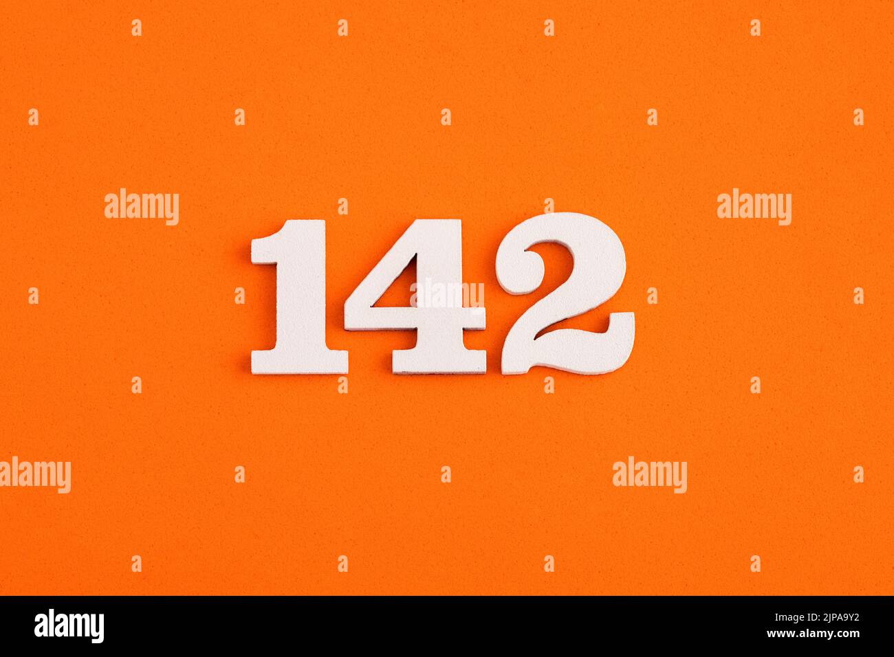 White wooden number 142 on eva rubber orange background Stock Photo - Alamy