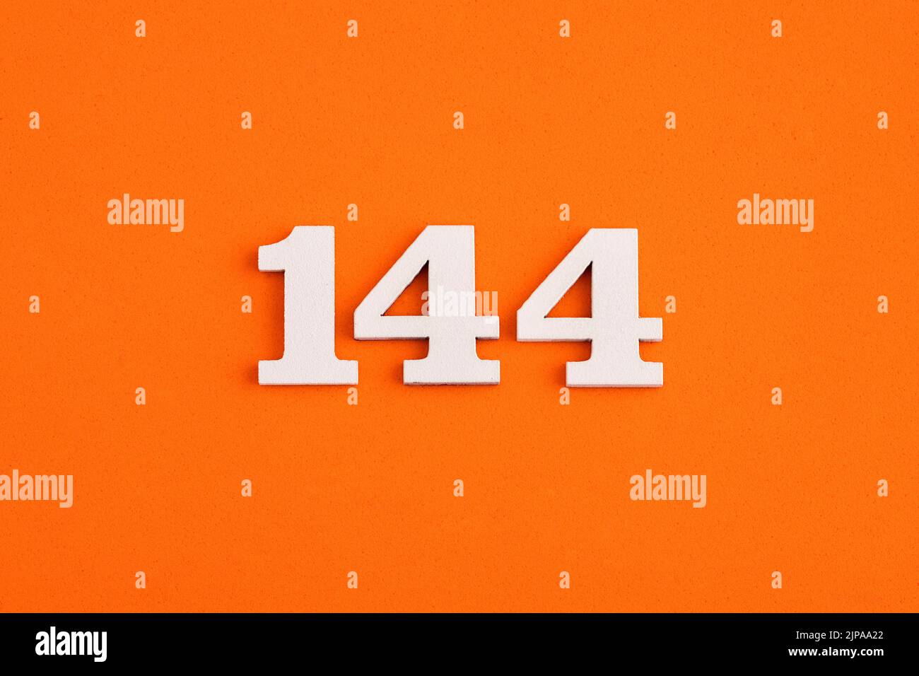 White wooden number 144 on eva rubber orange background Stock Photo - Alamy