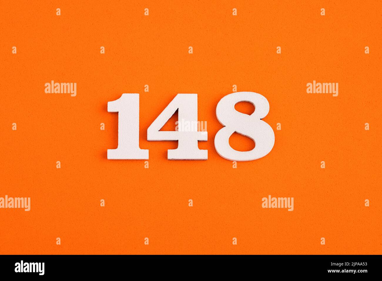 White wooden number 148 on eva rubber orange background Stock Photo - Alamy