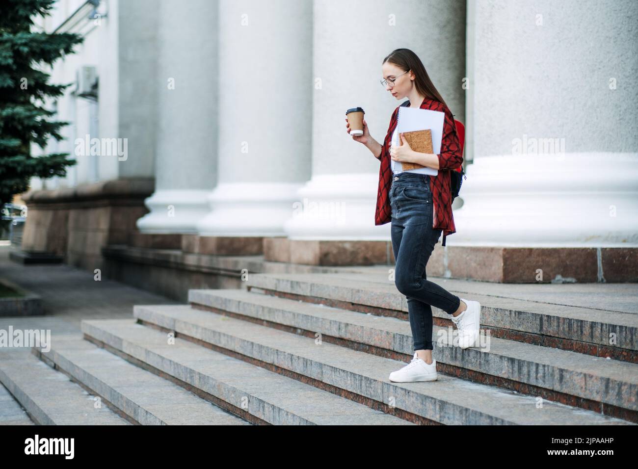 How to Choose College or University. Happy student girl with laptop and ...
