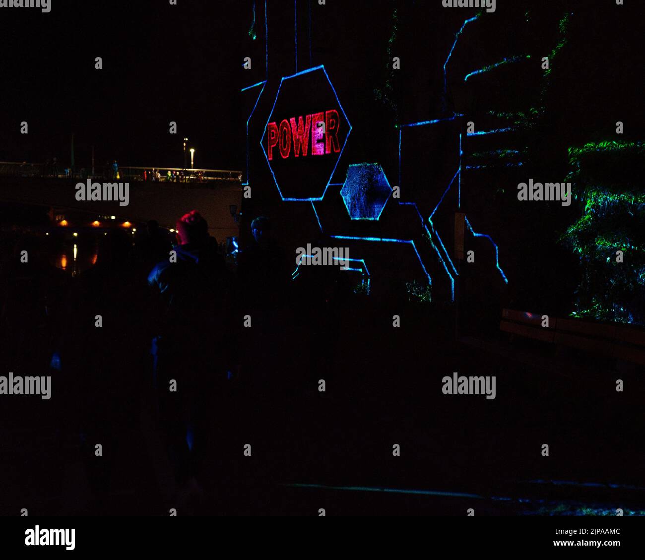 A colorful neon sign on the wall Stock Photo - Alamy