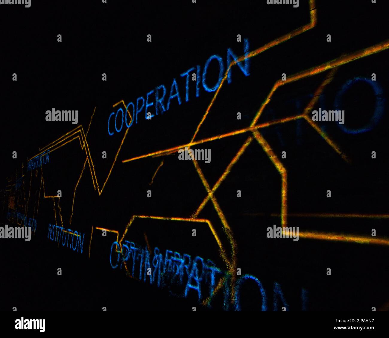 A colorful neon sign on the wall Stock Photo - Alamy