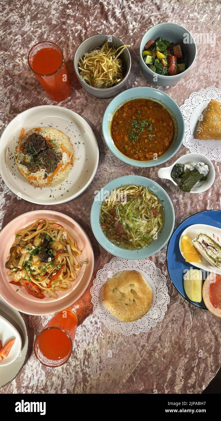 Top view of a table full of food in a cafe Stock Photo - Alamy