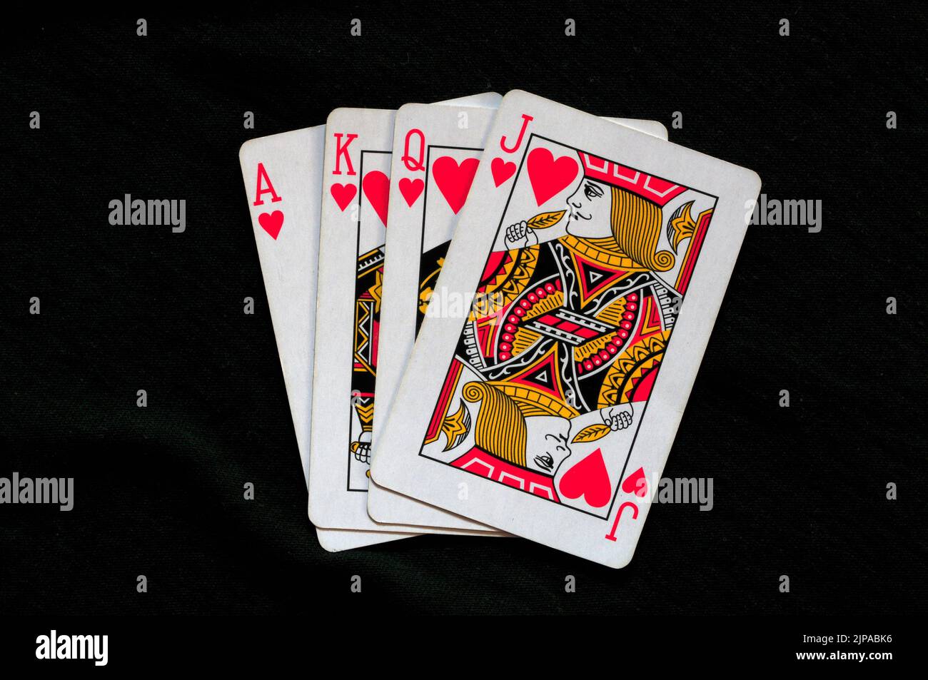 Hand of hearts playing cards Stock Photo - Alamy