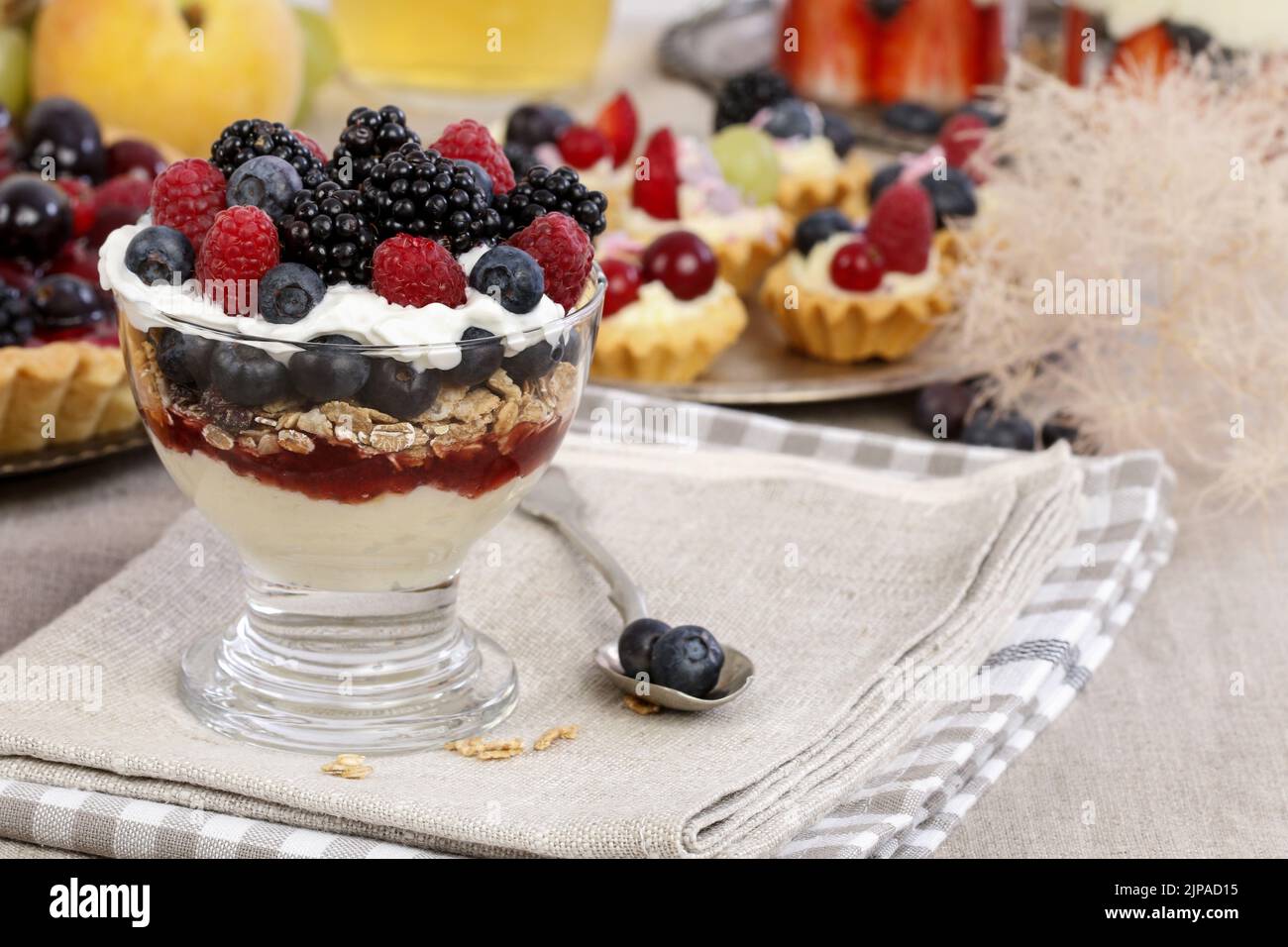 Layer fruit dessert in glass container. Summer party Stock Photo - Alamy