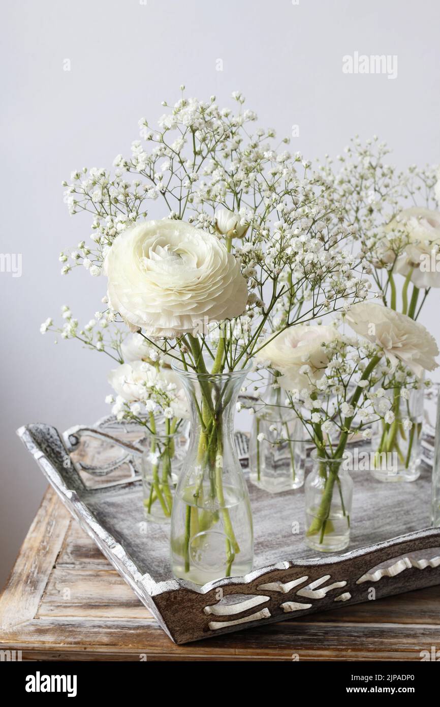 Floral arrangement with ranunculus flowers and white gypsophila ...