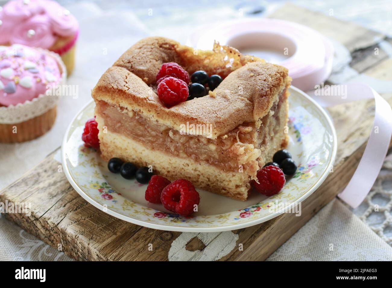 Apple pie decorated with raspberries and blueberries. Birthday party ...