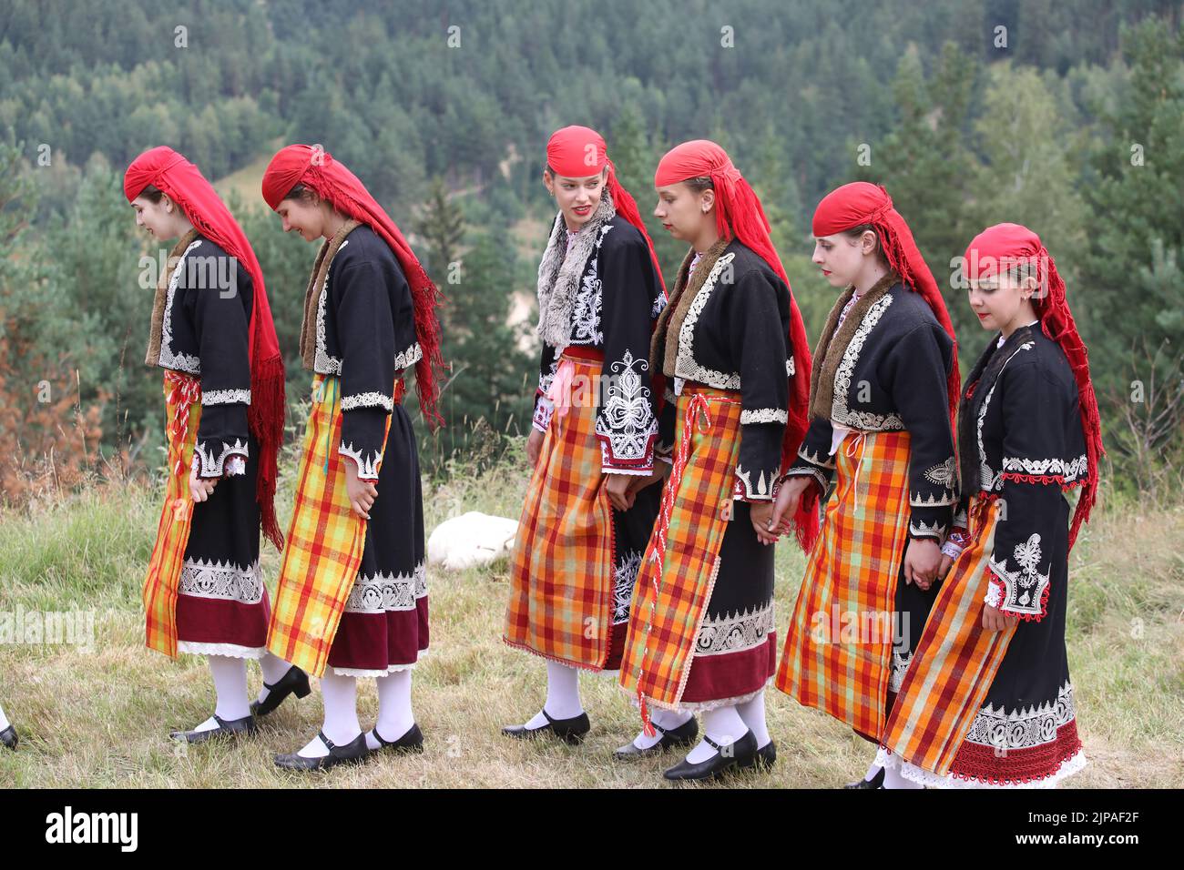 People in traditional folk costume of The National Folklore Fair in ...