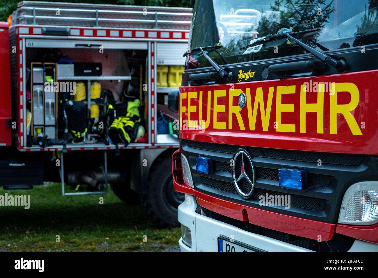 Fire brigade 'Feuerwehr' lettering on a fire engine car. Technical ...