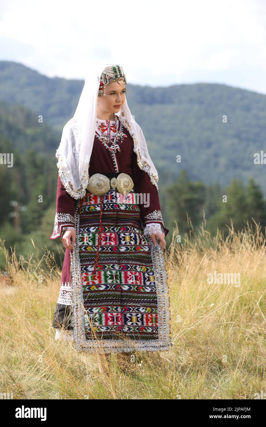 People in traditional folk costume of The National Folklore Fair in ...