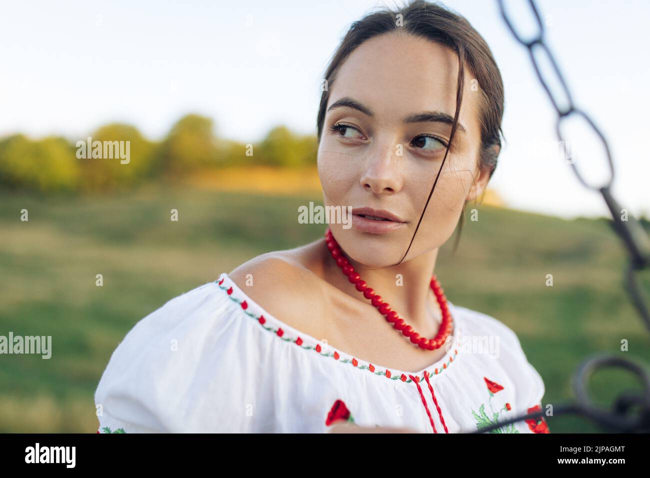 Portrait of young Ukrainian woman in traditional national embroidered ...
