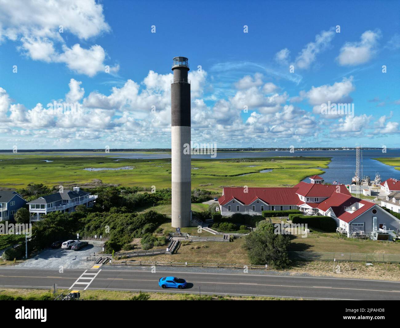 A car driving past a lighthouse Stock Photo - Alamy