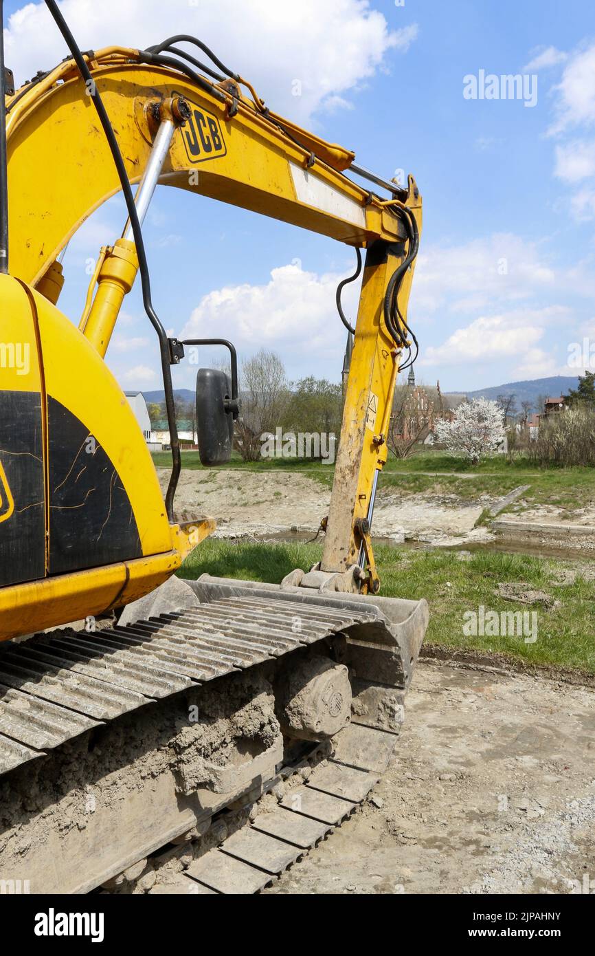 Construction site large backhoe parked hi-res stock photography and ...