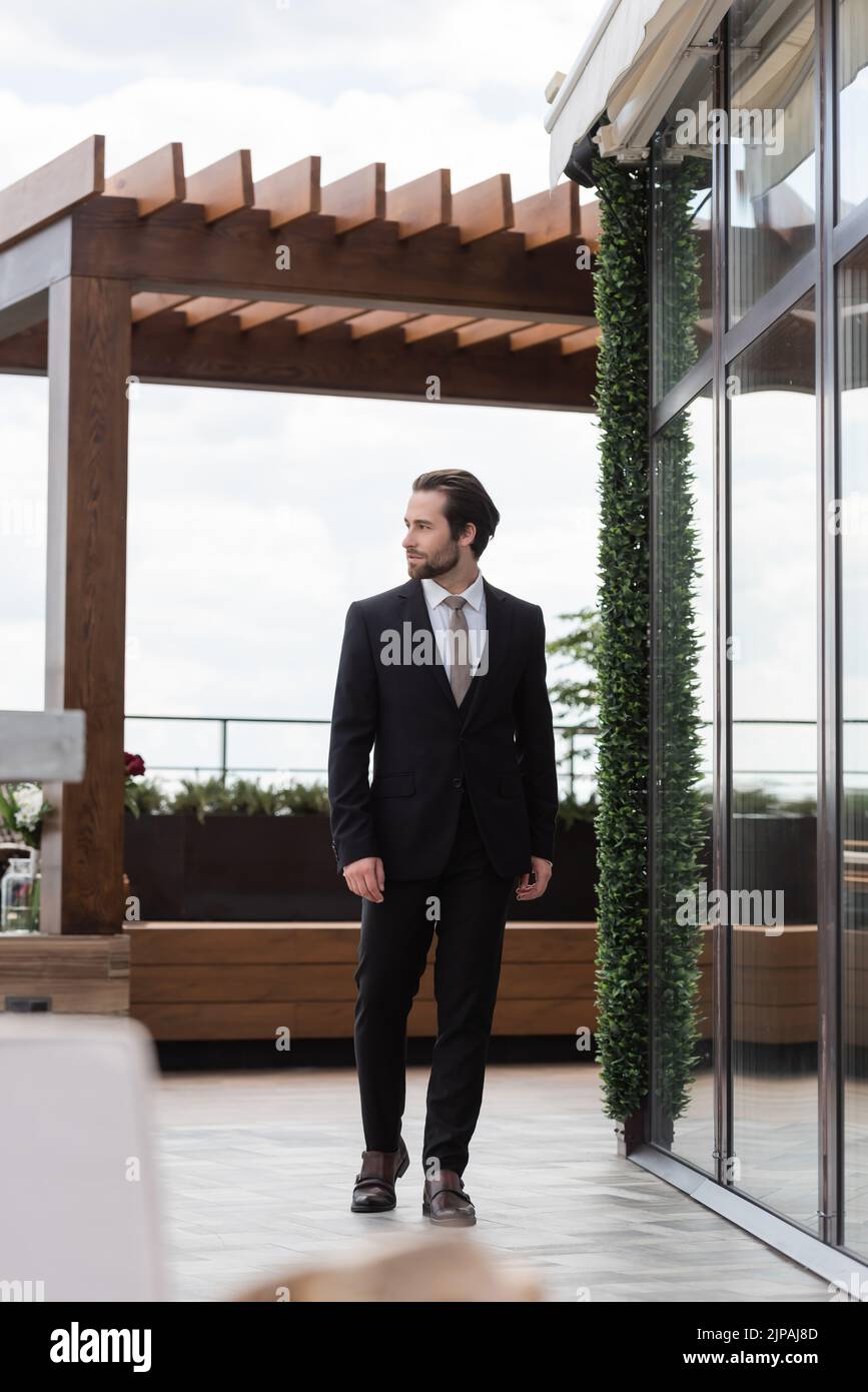 Handsome young man walking restaurant hi-res stock photography and ...