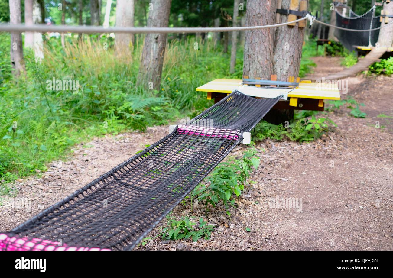 Rope park, obstacle course in the amusement park Stock Photo - Alamy