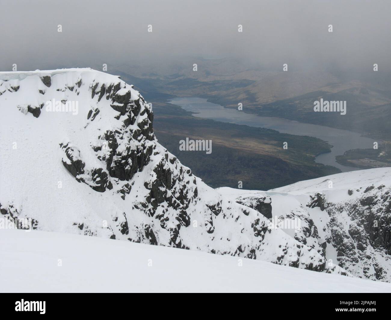 Snow covered Ben Nevis overlooking the valley Stock Photo - Alamy