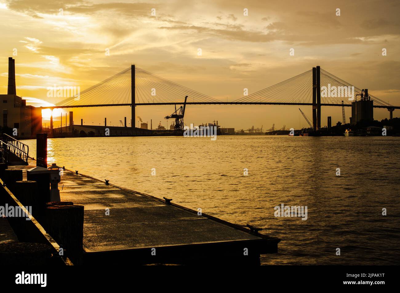A mesmerizing view of a modern bridge above a lake during a scenic ...