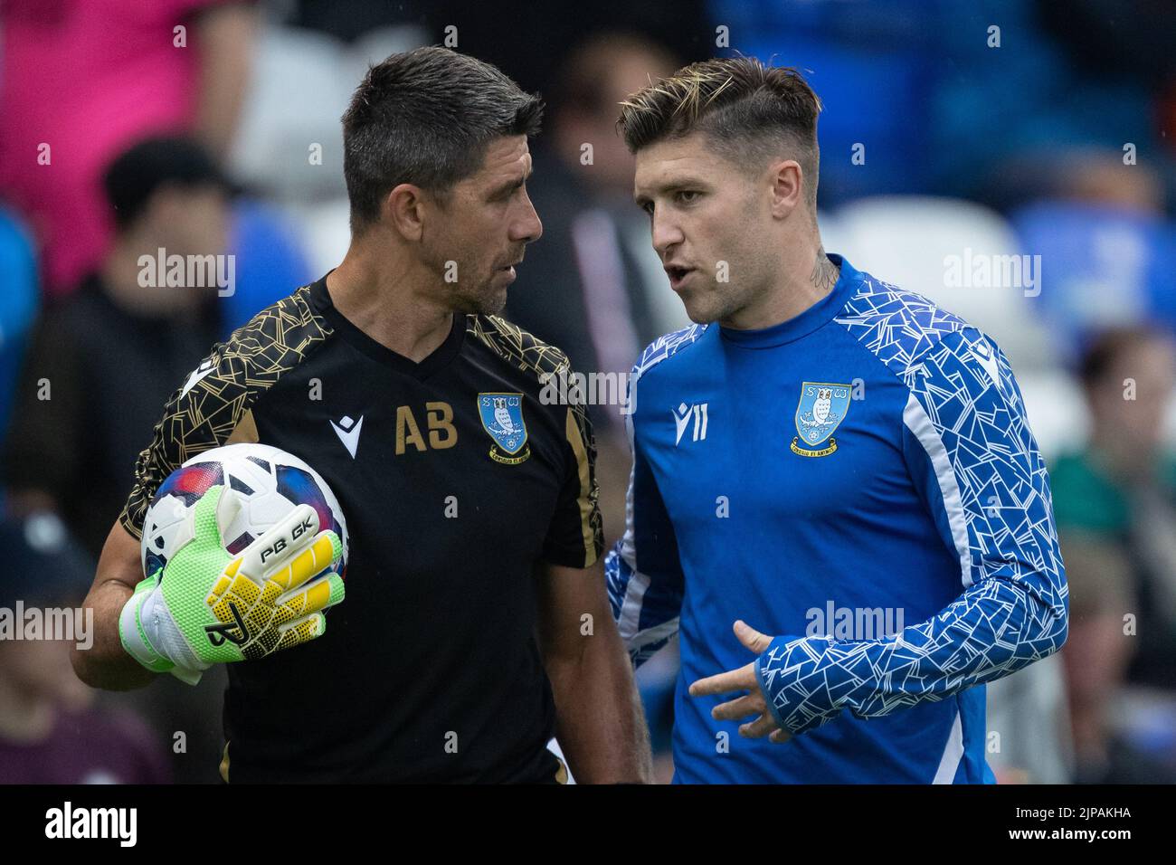 Josh Windass #11 of Sheffield Wednesday speaks with goalkeeping coach ...