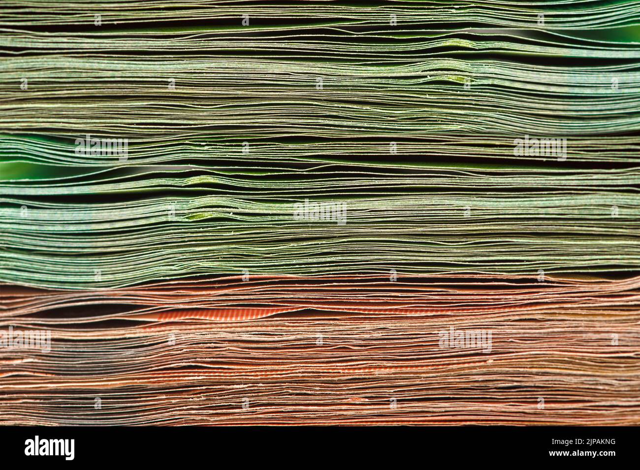Close-up of a stack of paper bills, side view. Euro banknotes stacked ...