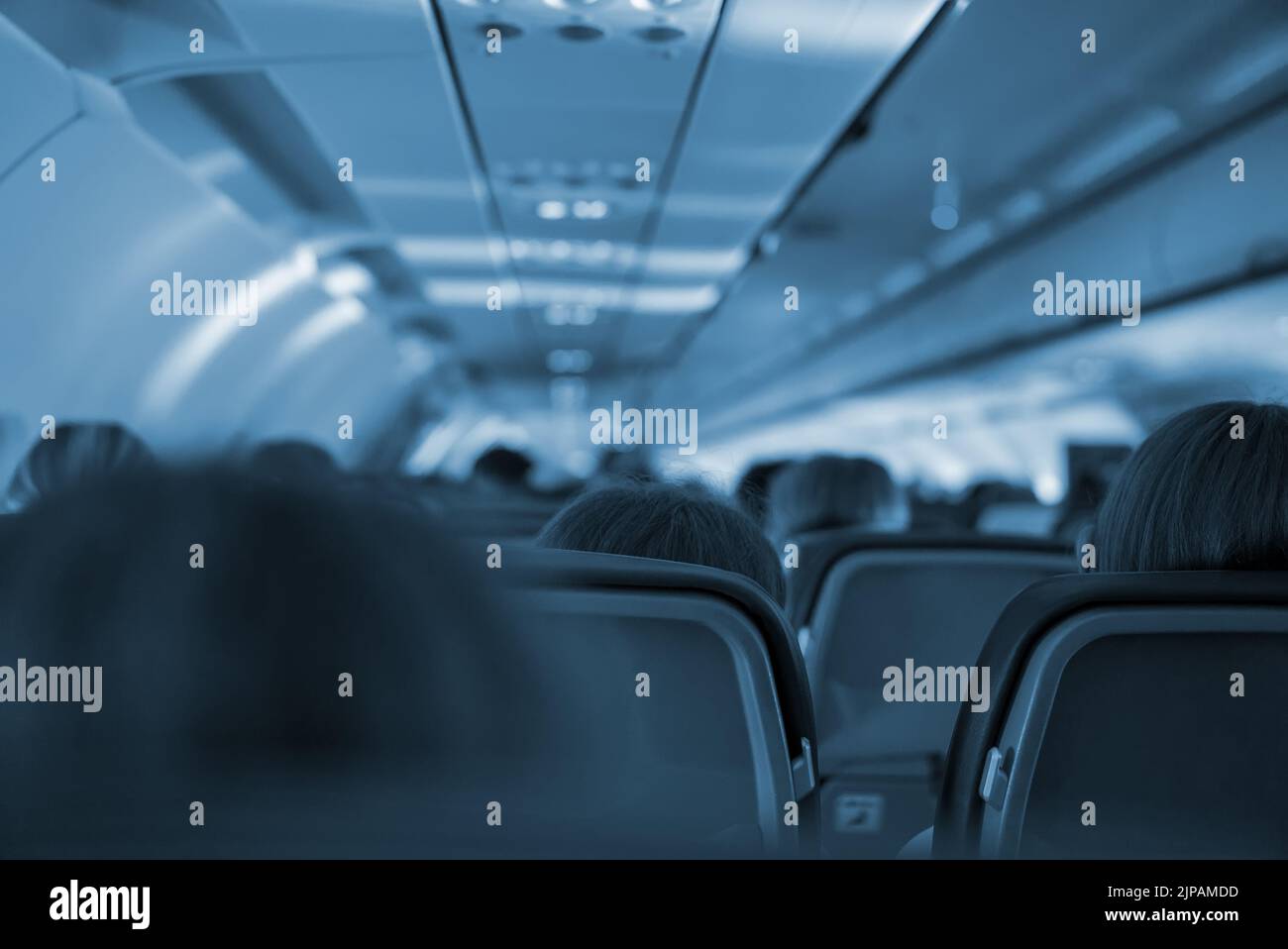 Interior inside of the plane with passengers Stock Photo - Alamy