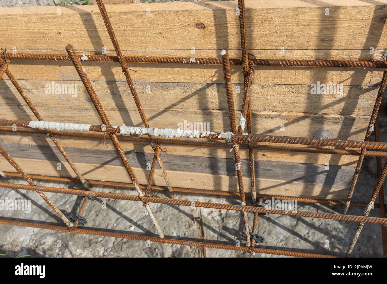 Tied reinforcement and mounted strip foundation formwork close-up Stock ...