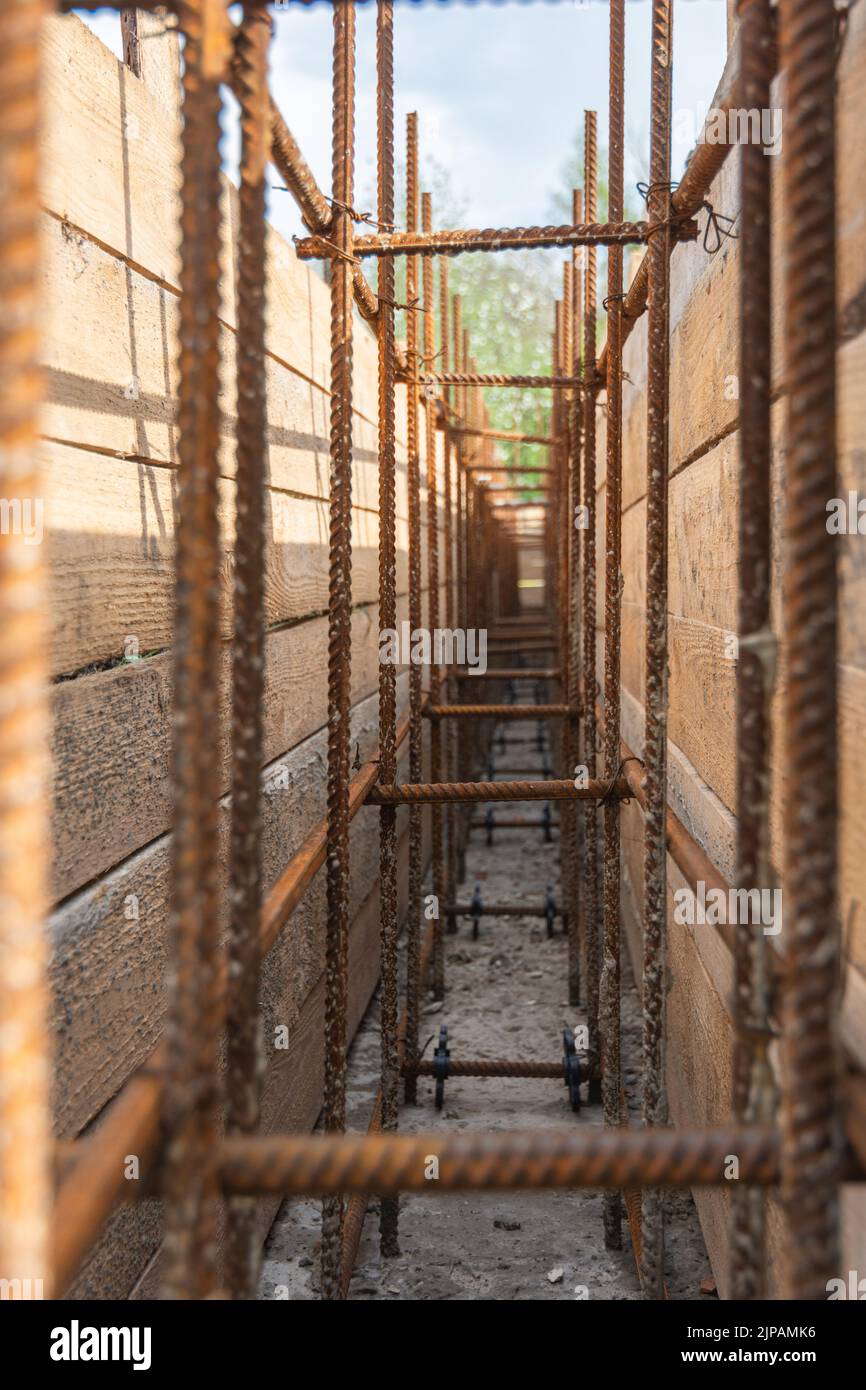 Close-up of tied reinforcement and mounted strip foundation formwork ...