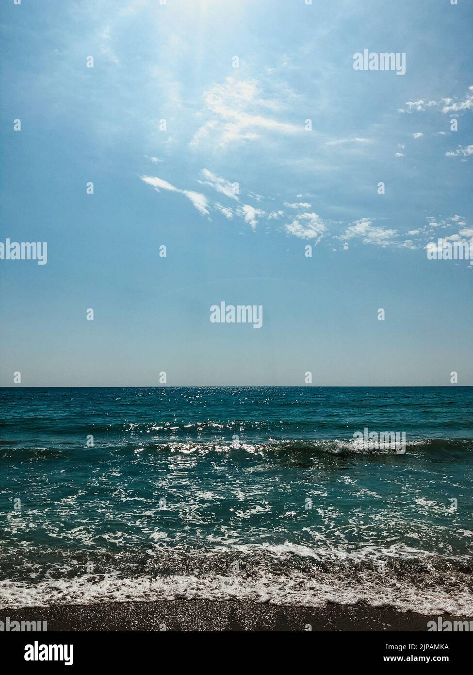 Sea blue aquamarine waves line sunny sand beach. Soft wave of ocean ...