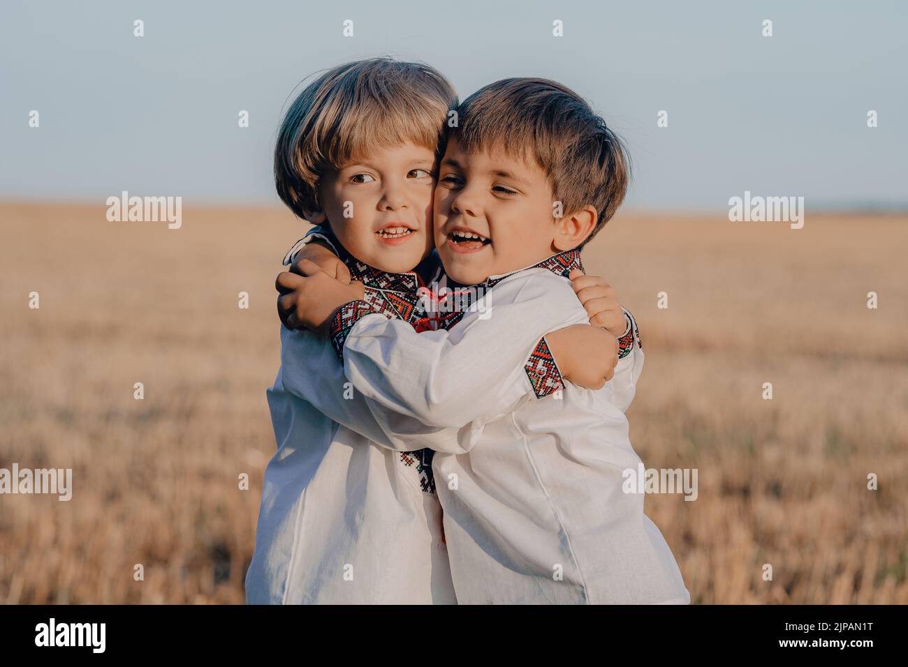 Smiling little ukrainian boys. Children together in traditional ...