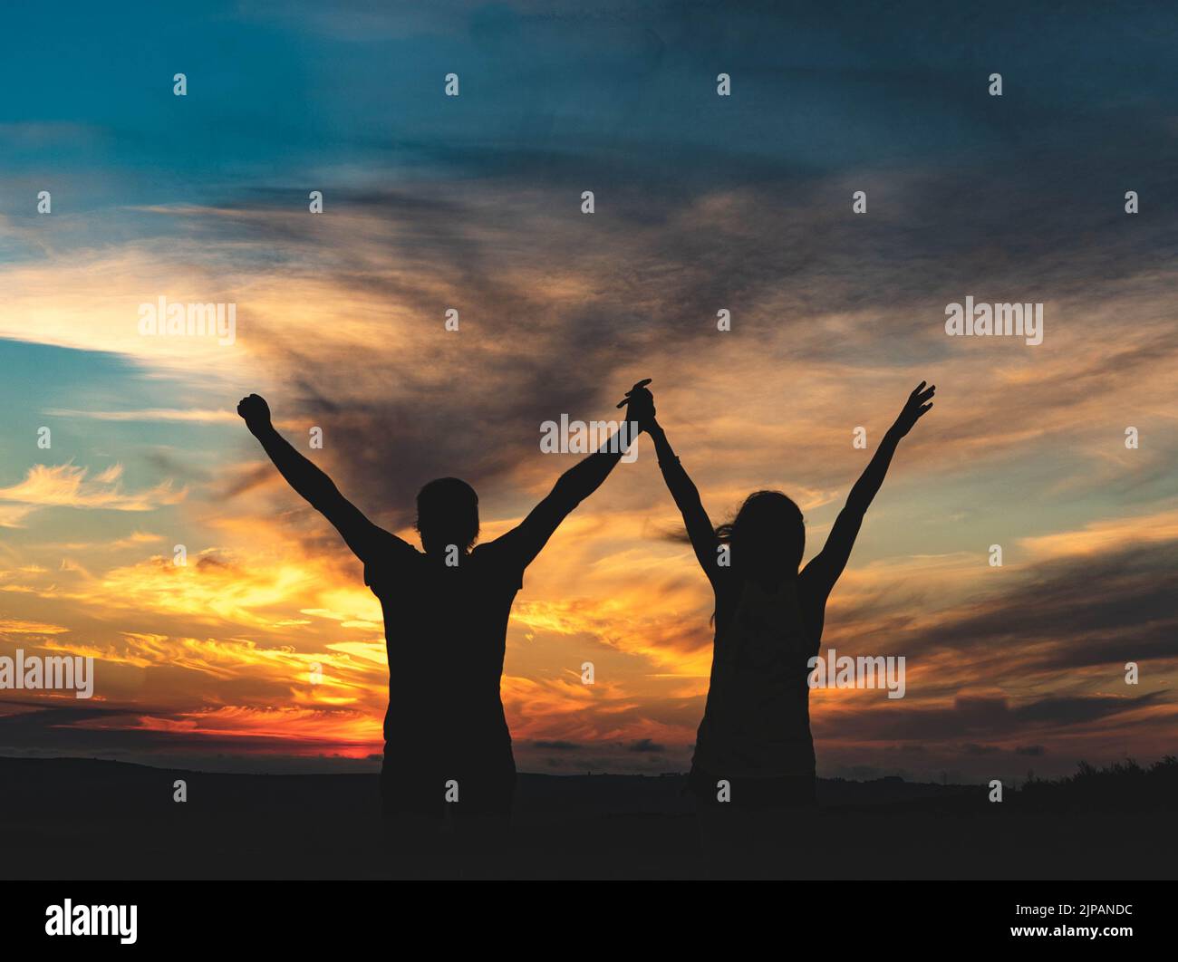 Woman raised two hands hi-res stock photography and images - Alamy
